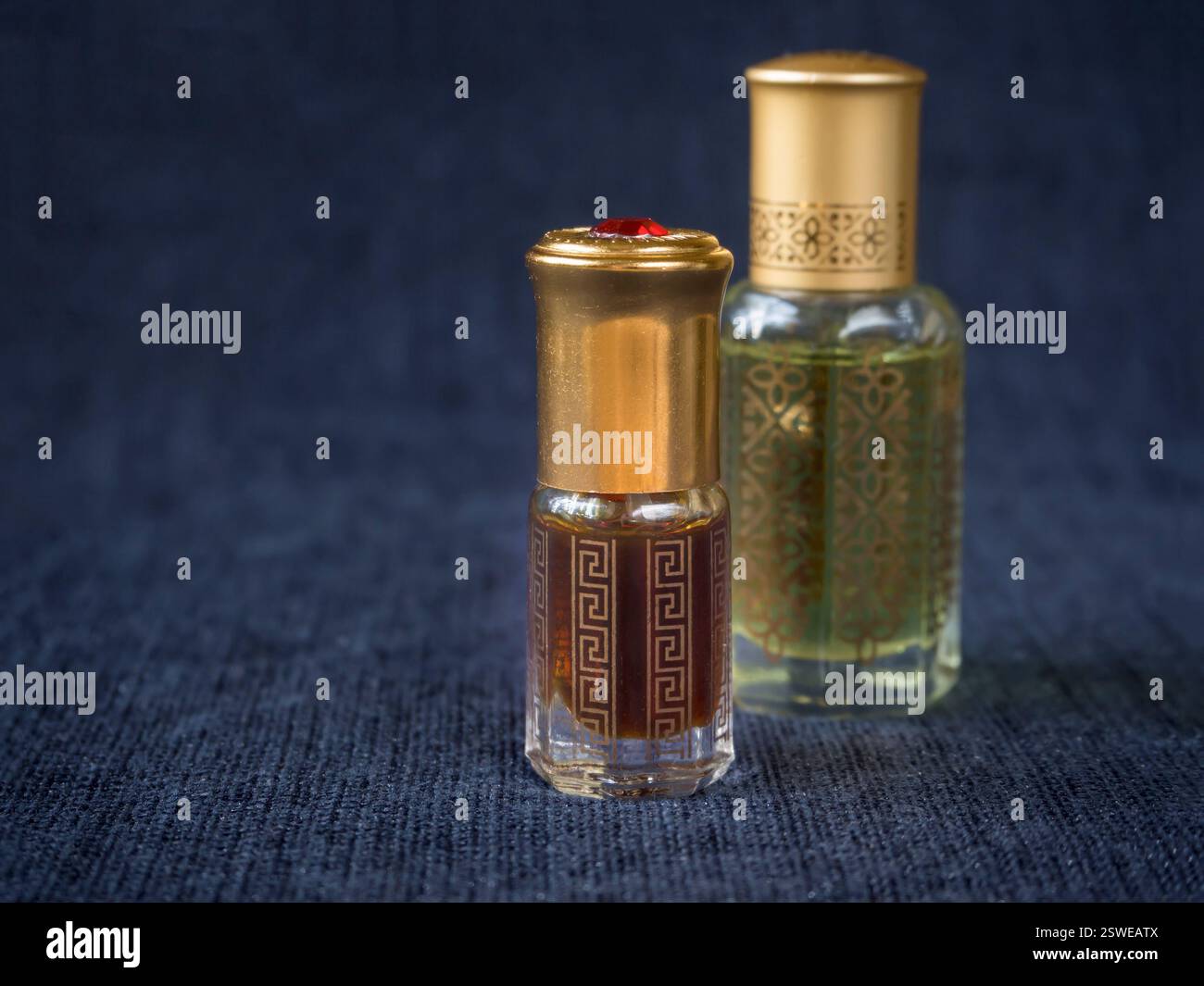 Arabian oud attar perfume or agarwood oil fragrances in mini bottles ...