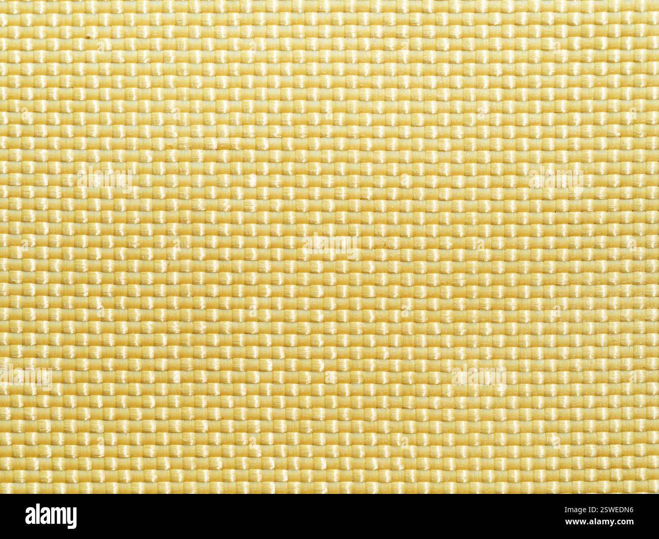 Bulletproof material aramid. Shining aramid kevlar background. Yellow kevlar texture and pattern ...