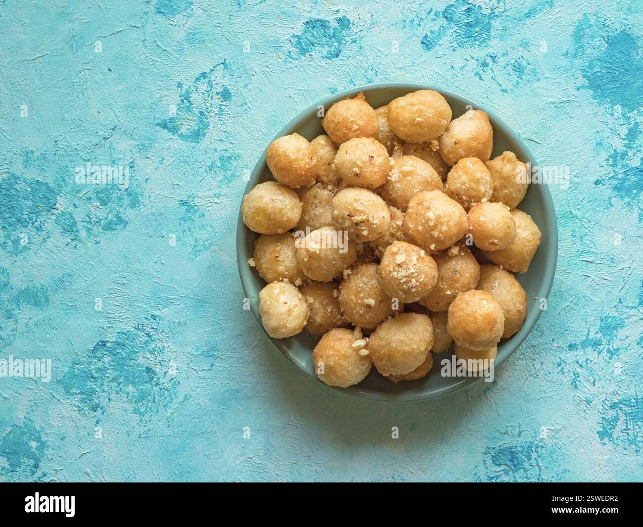 Traditional Greek sweets Loukoumades from dough with honey syrup Stock ...