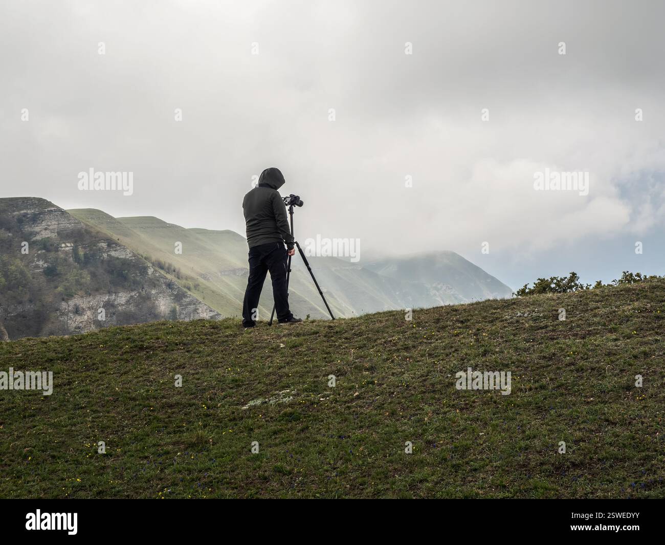 Adventure photographer camera shoots standing hi-res stock photography ...