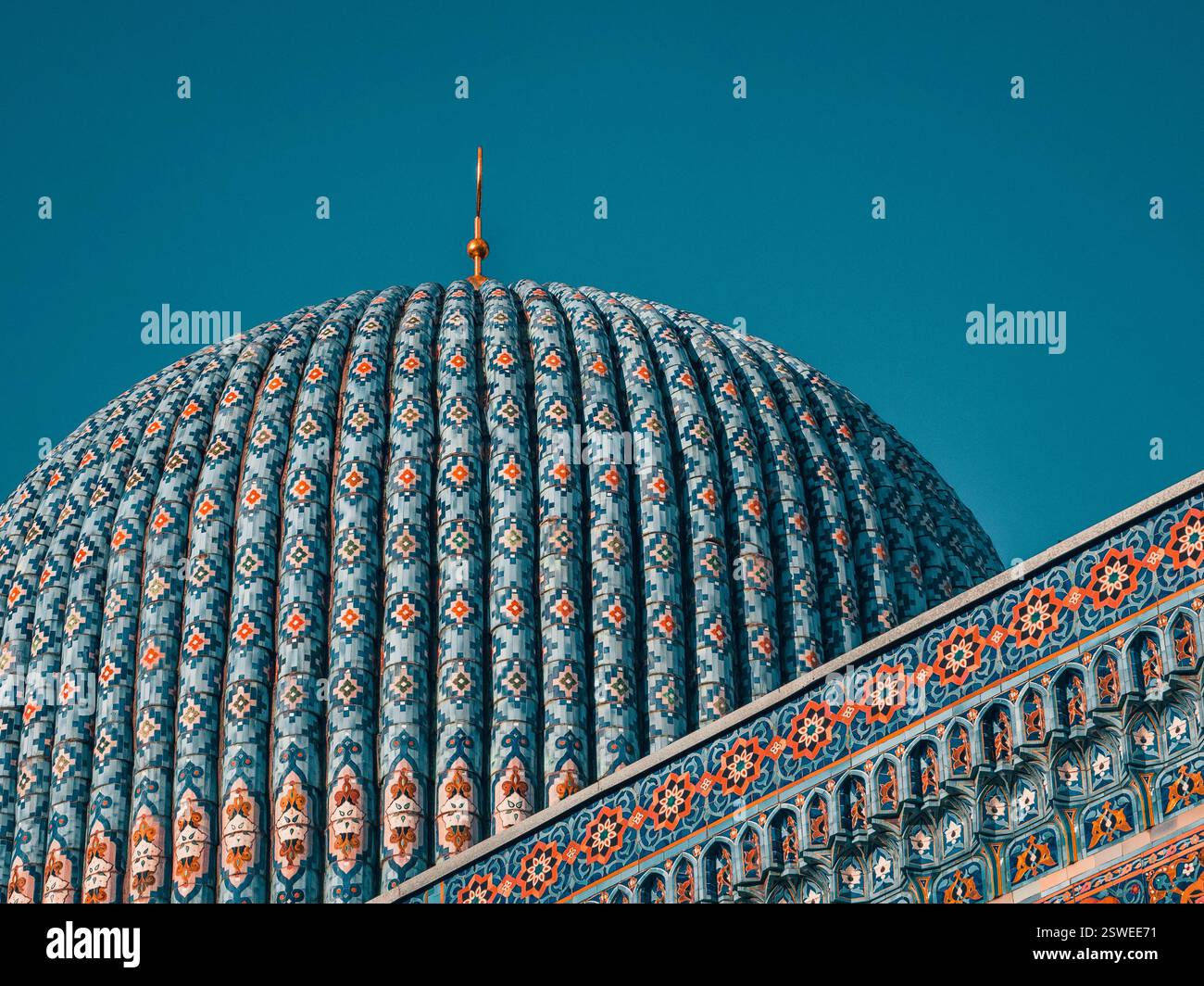 Beautiful tower of the mosque against the blue sky Stock Photo - Alamy