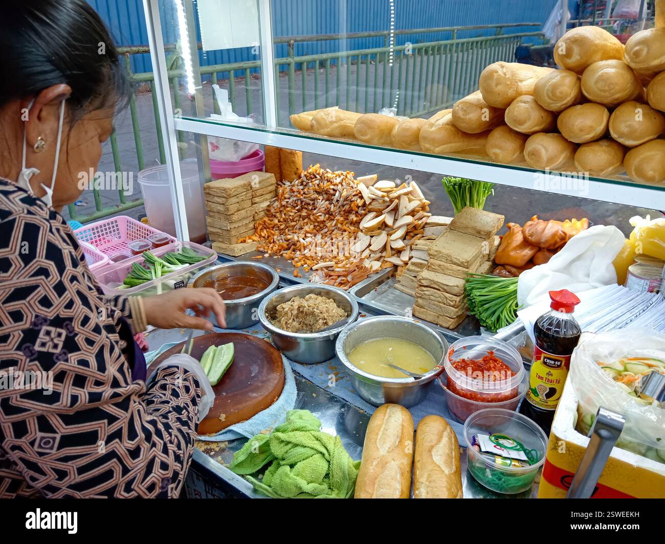 Phnom Penh, Cambodia February 19, 2025: A Cambodian Khmer woman street food vendor in Phnom Penh ...