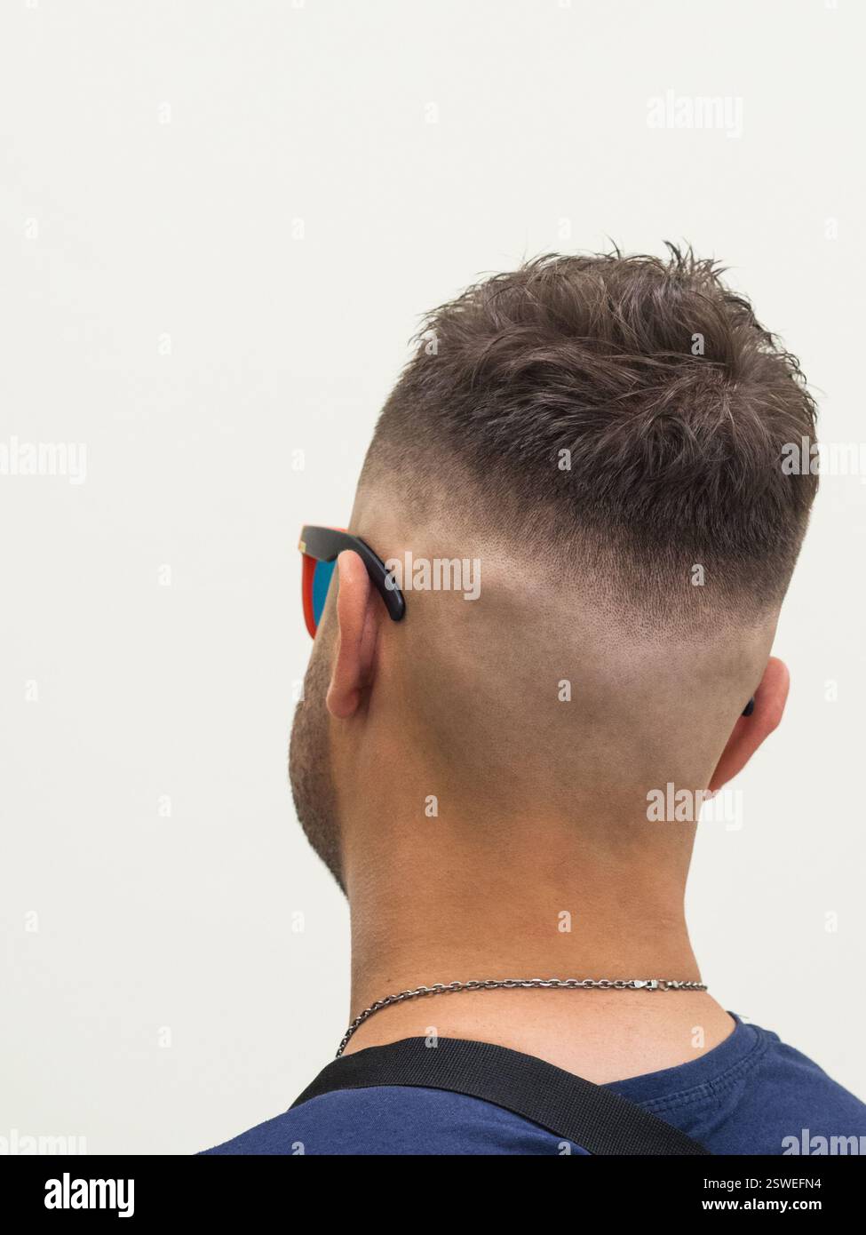 A young man with a clean-shaven head Stock Photo - Alamy