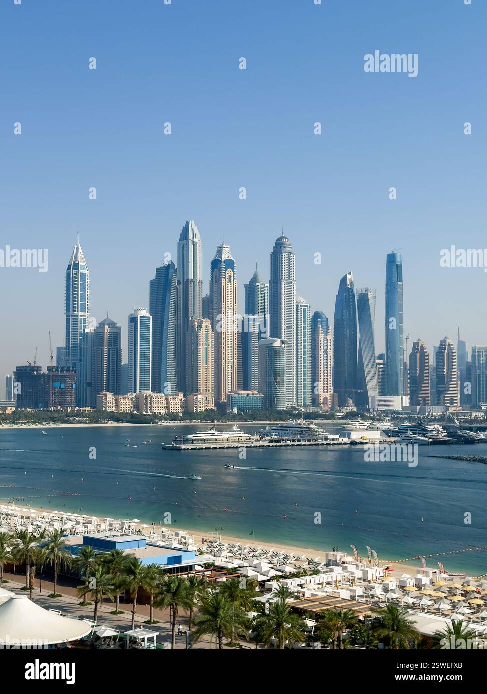 Beautiful vertical view of the skyscrapers in Dubai at dawn Stock Photo ...