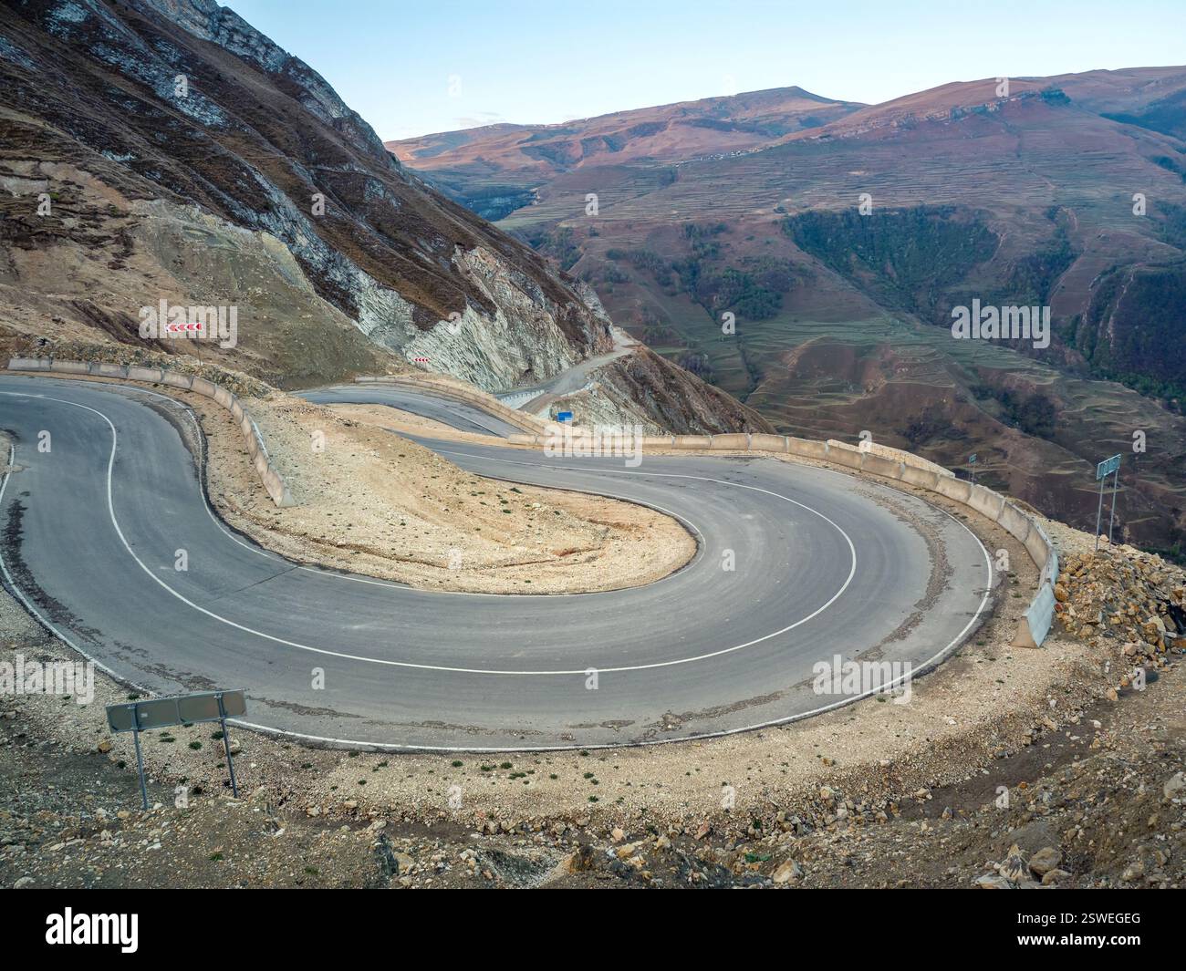 Mountain serpentine road loop. Morning mountain valley with a ...