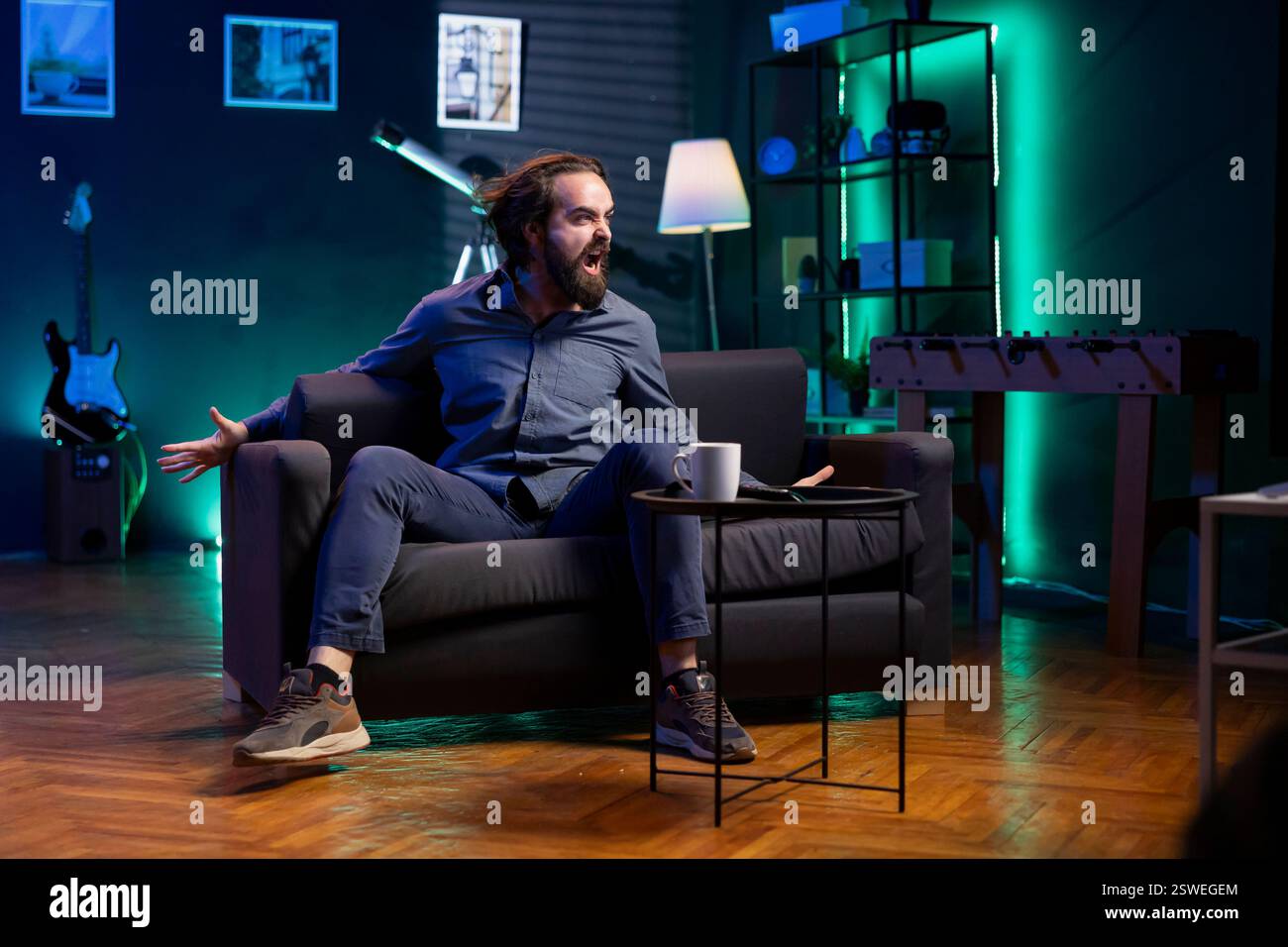 Livid supporter watching sports match on live television broadcast ...