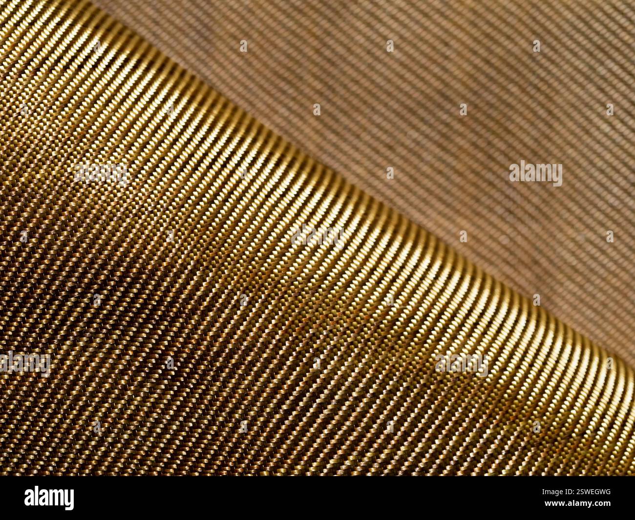 The bend of the golden fabric bulletproof material aramid. Aramid ...