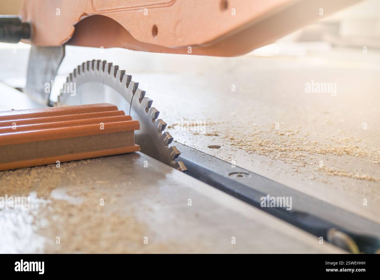 MDF profile sawing. Cut the parts from MDF profile on a circular saw at ...