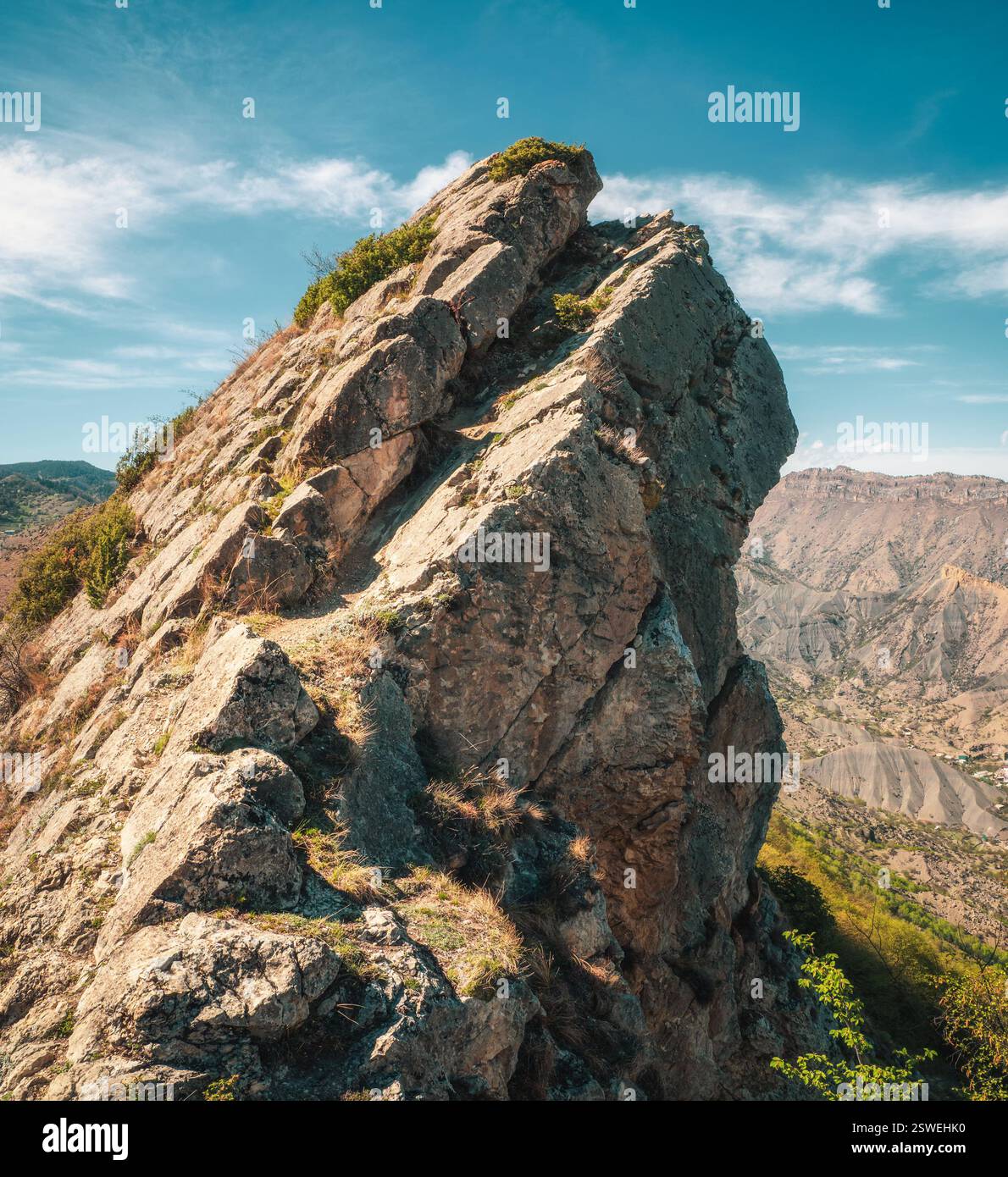 Rocky sharp mountain ridge with a chasm Stock Photo - Alamy