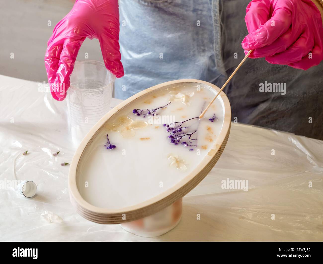 The art process of pouring epoxy resin into a wooden toy. Technology ...