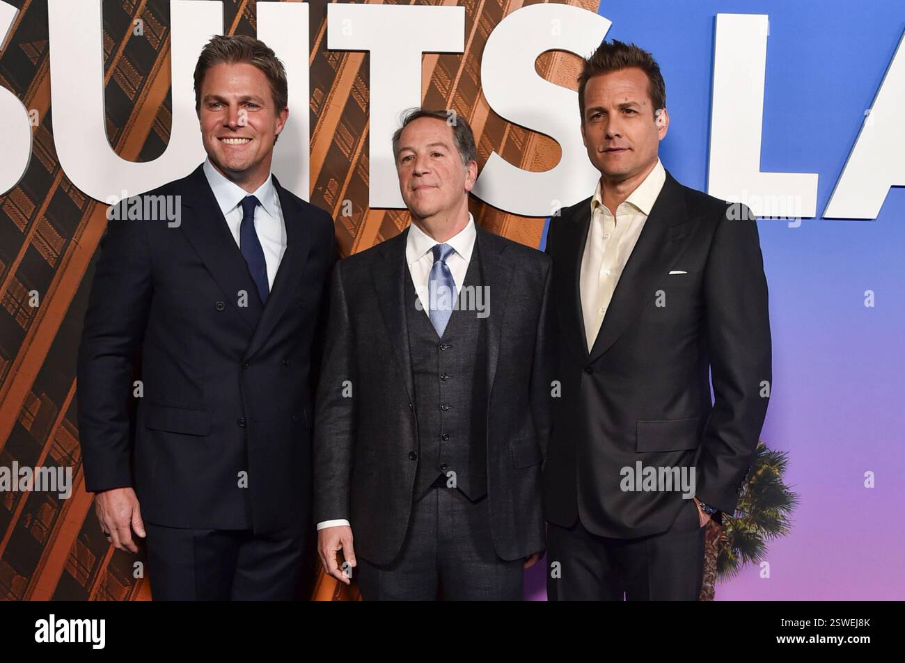 Stephen Amell, from left, Aaron Korsh, and Gabriel Macht arrive at the ...