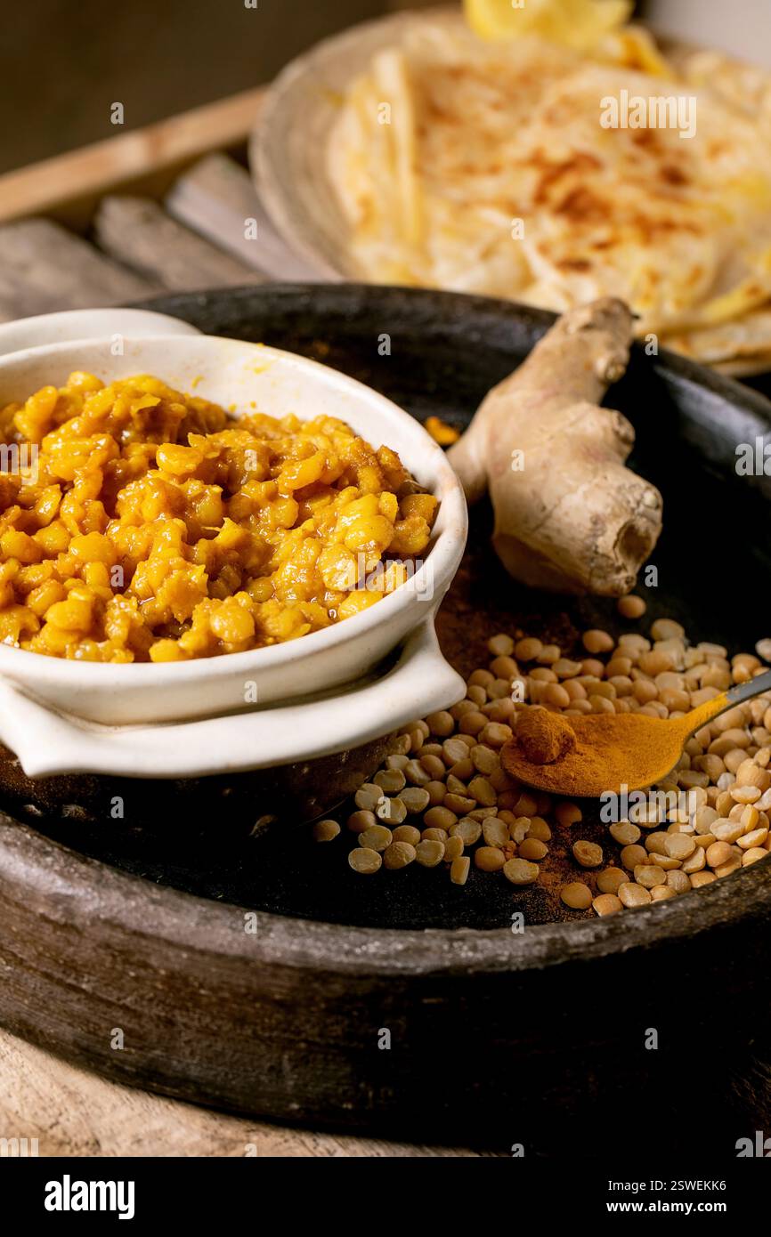 Traditional indian yellow pea food dal with roti bread Stock Photo - Alamy