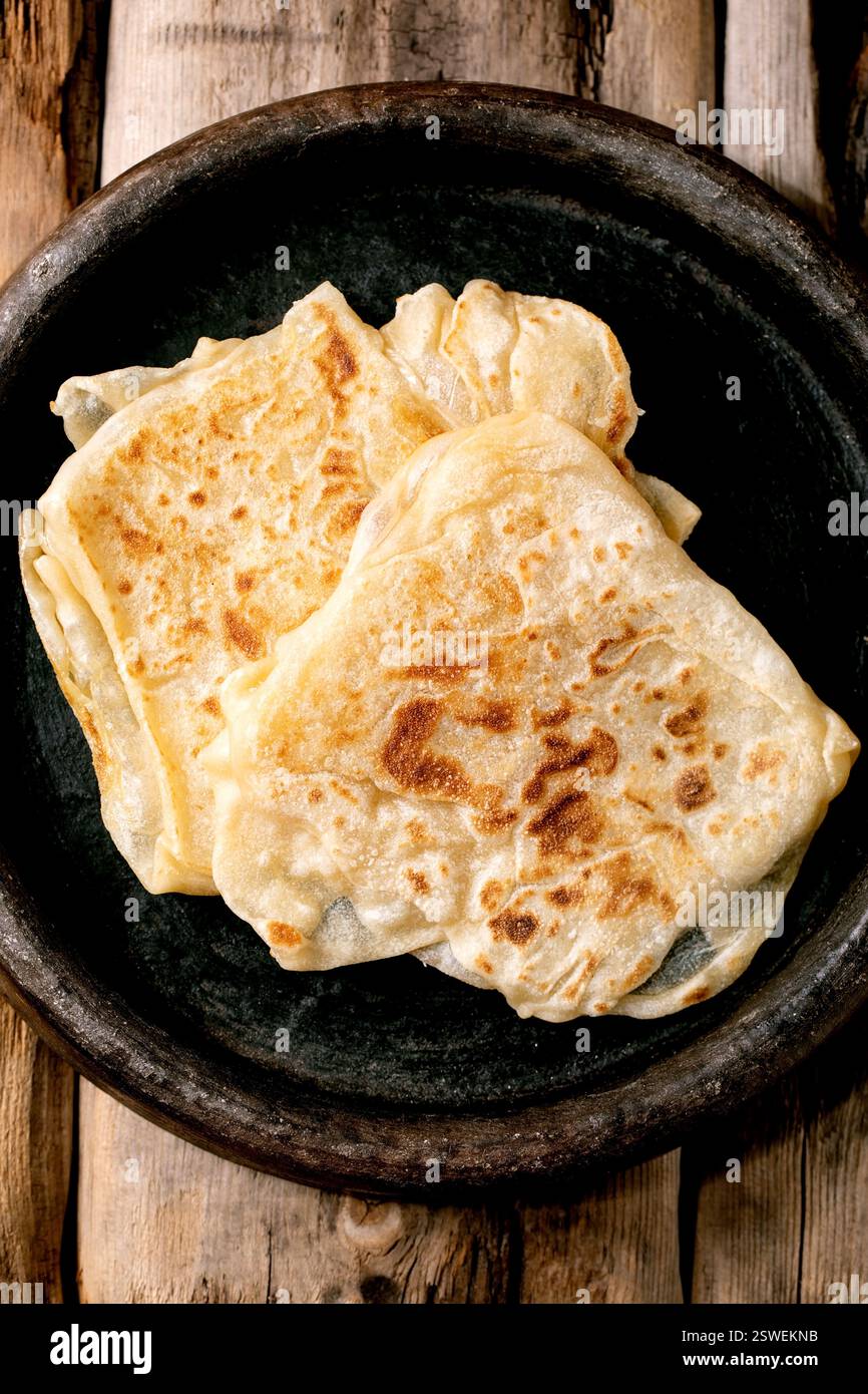 Traditional indian homemade roti flatbread in ceramic dish Stock Photo - Alamy