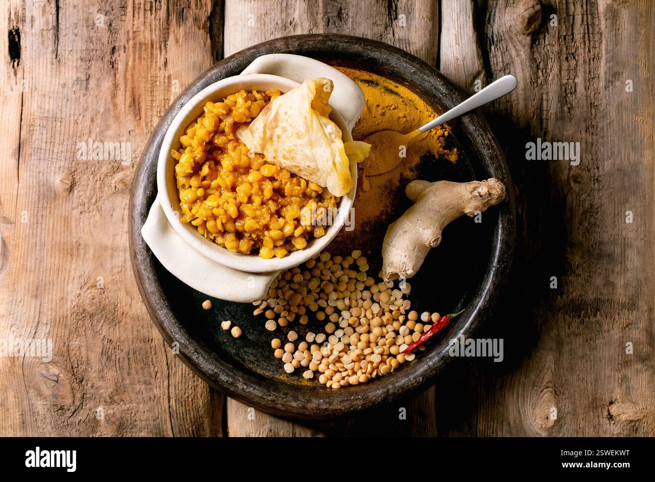 Traditional indian yellow pea food dal with roti bread Stock Photo - Alamy