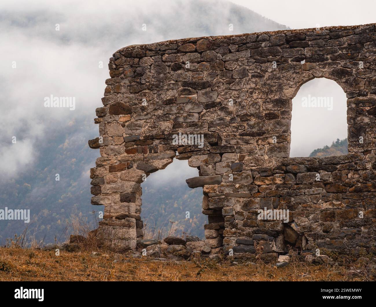 Old stone wall with arched passage. Old Egical towers complex, one of ...