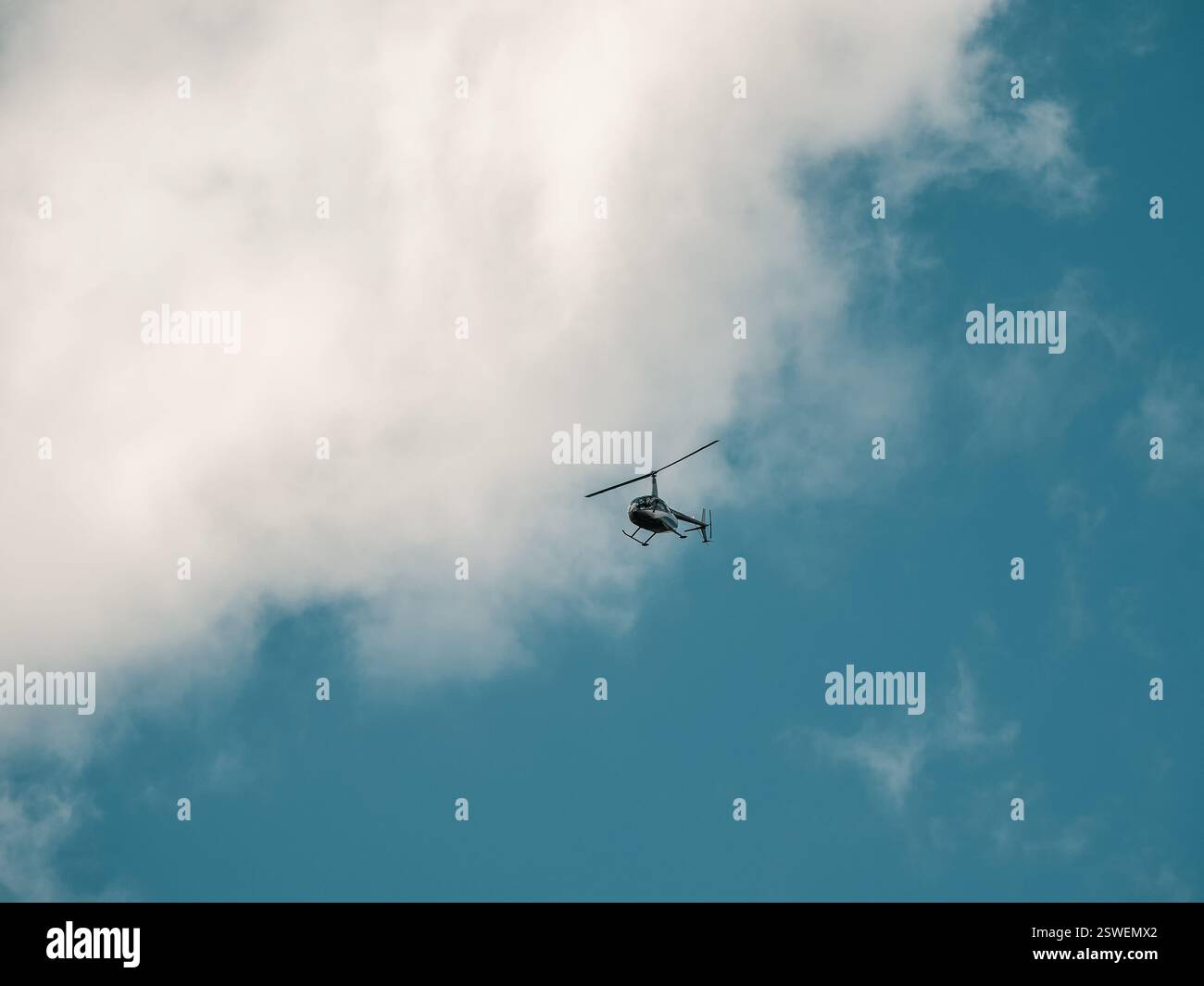 Civil helicopter in cloudy hi-res stock photography and images - Alamy
