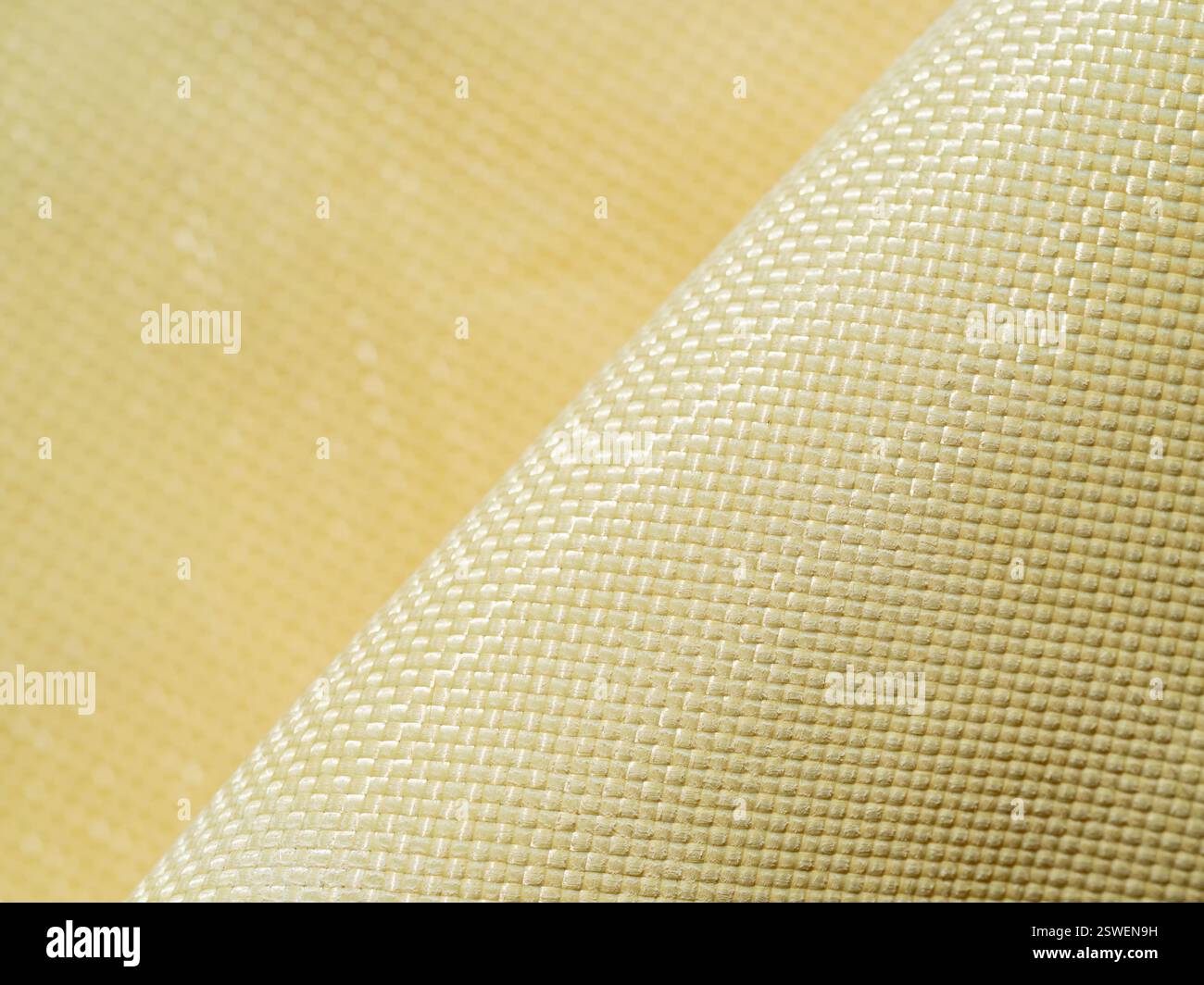 Bulletproof material aramid. Shining aramid kevlar background. Golden ...