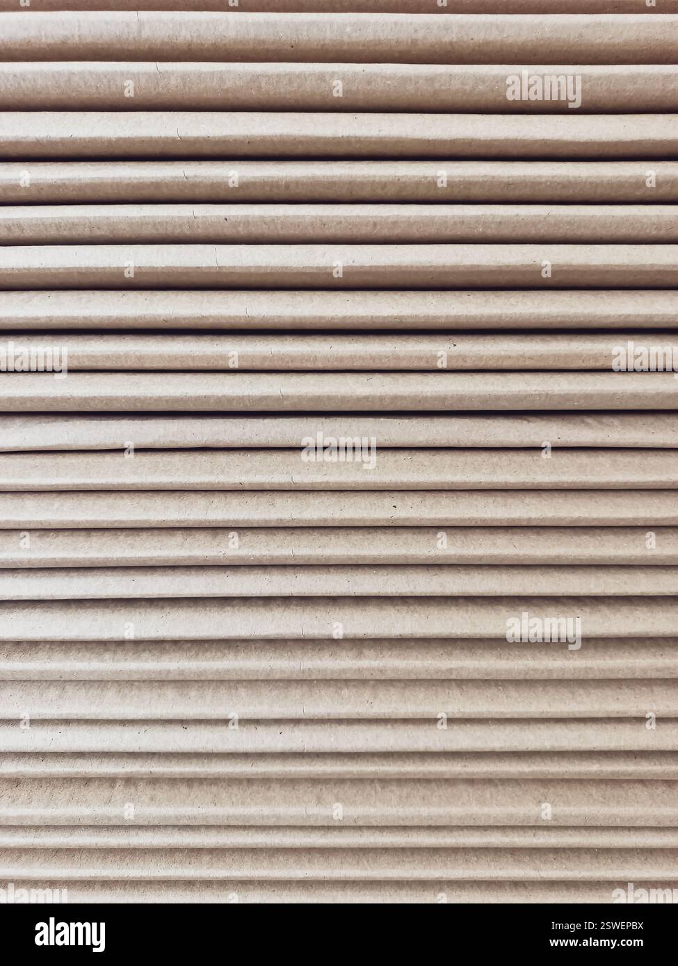 Side view of a corrugated cardboard. Cardboard boxes are folded on a ...