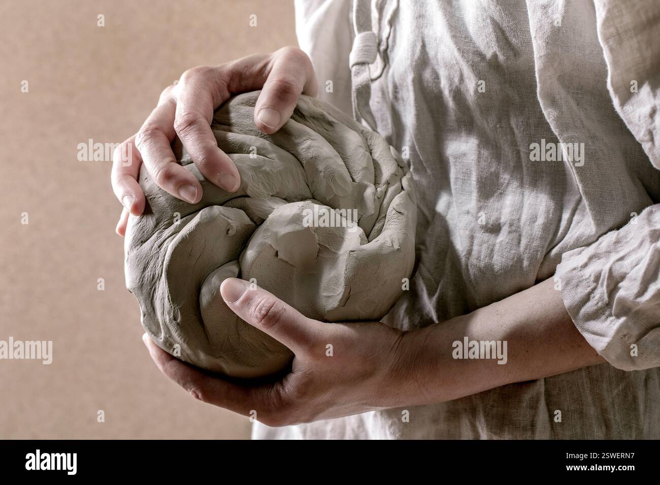 Hands in clay ceramic hi-res stock photography and images - Alamy