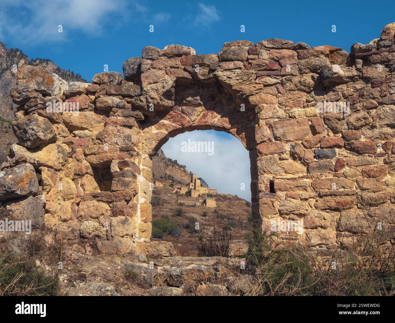 Old stone wall with arched passage. Old Egical towers complex, one of ...