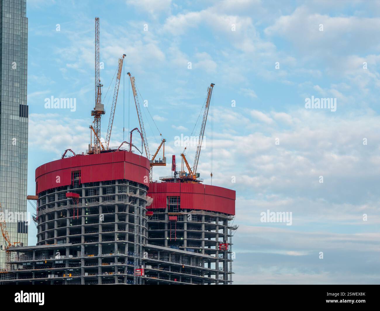 Construction work site and high rise building. High-rise building under ...