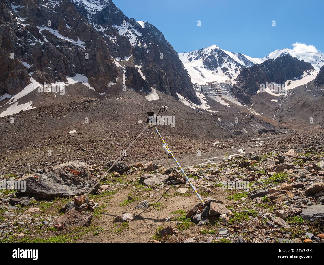 Automatic weather station in the mountains. Distant mountain range ...