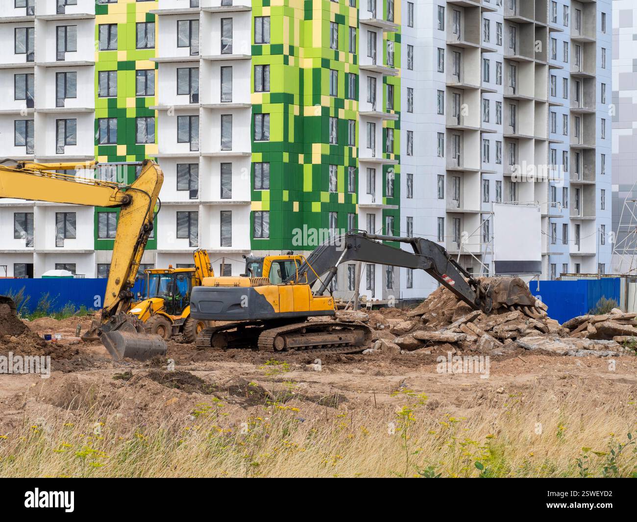 Excavator digs the ground for the foundation and construction of a new ...