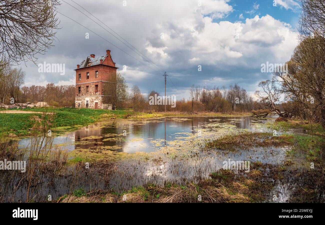 Panorama of the Izvarka river on a cloudy May day. The old Trout tower ...