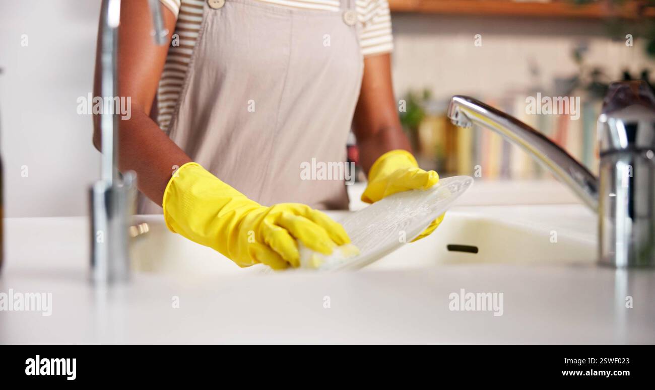 Hands, washing dishes and soap with plate in kitchen for hygiene ...