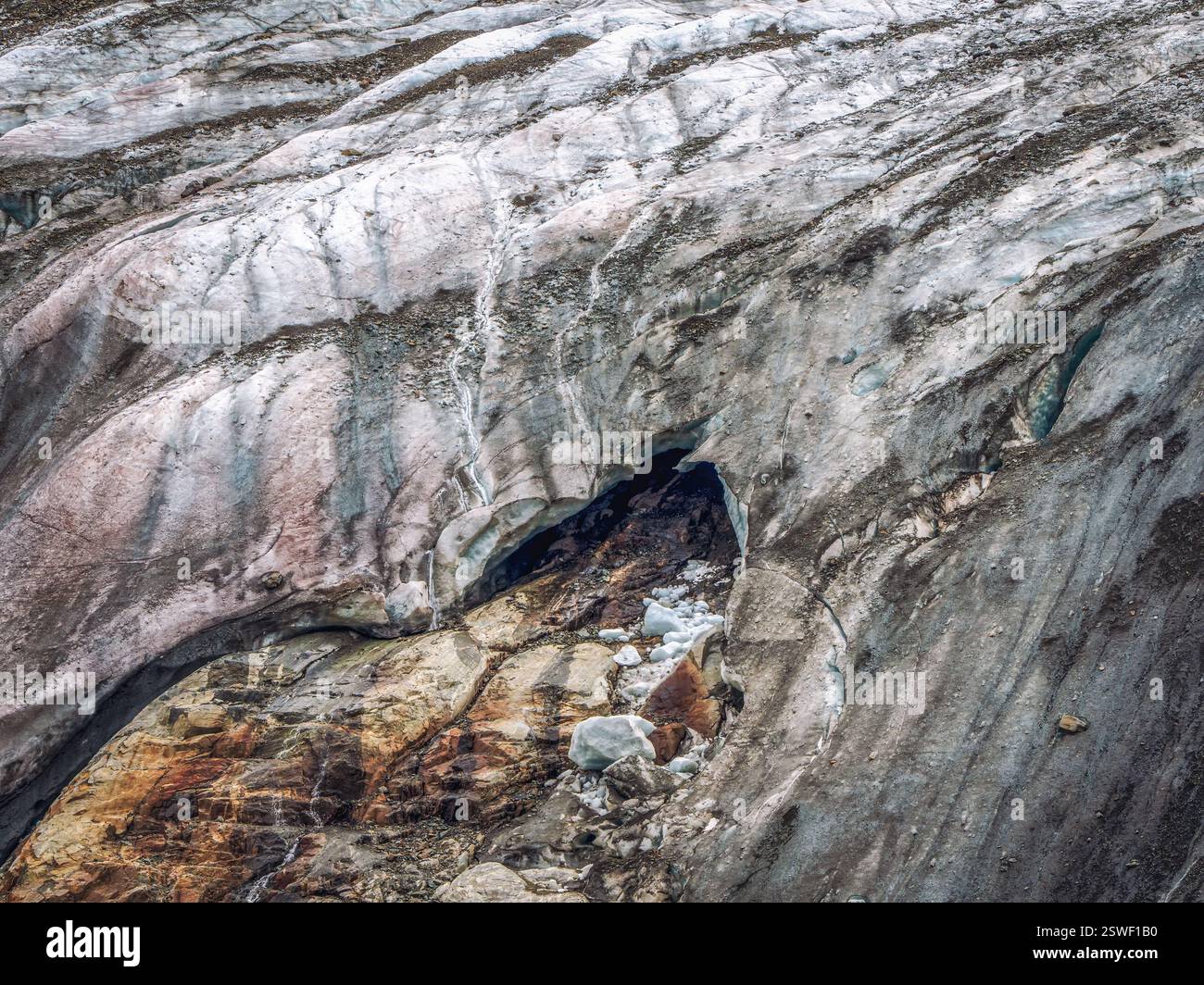 Minimalist nature background of glacier surface with cave and cracks ...