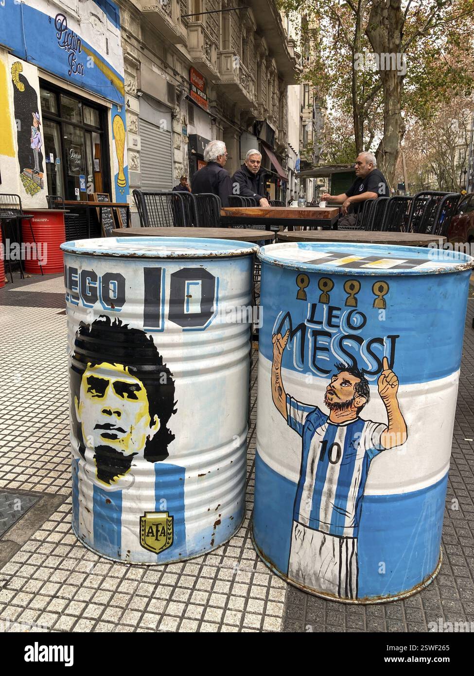 Outdoor area of a bar with pictures of Lionel Messi and Diego Maradonna ...
