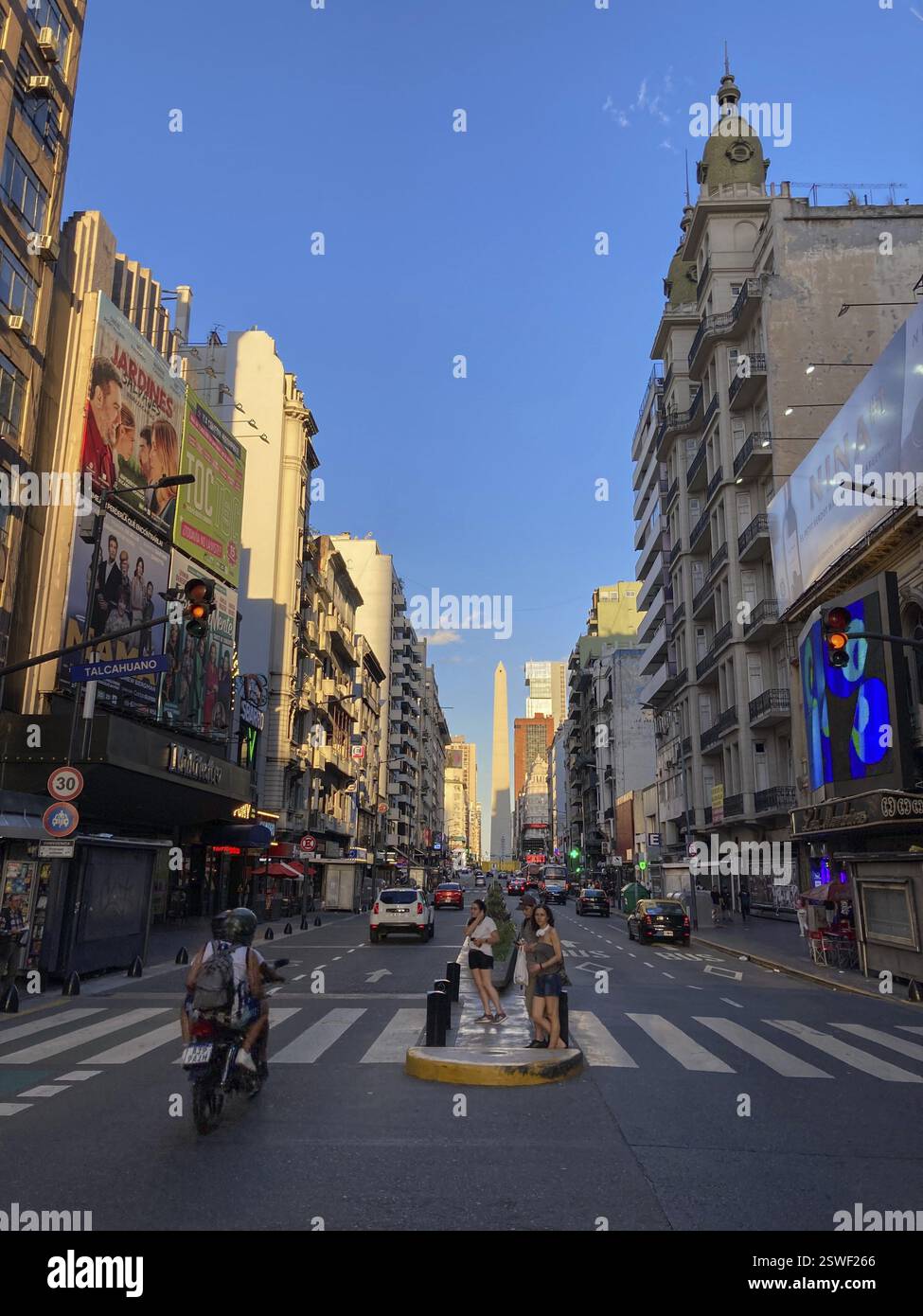 Avenida Corrientes with the obelisk in the city centre in the evening ...