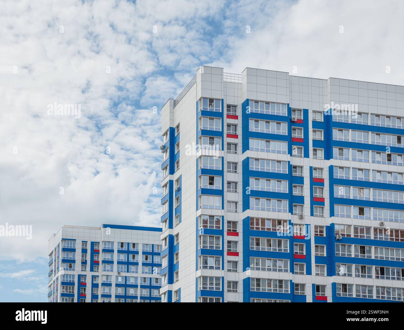 Modern beautiful new high-rise residential buildings. Colored wall on ...