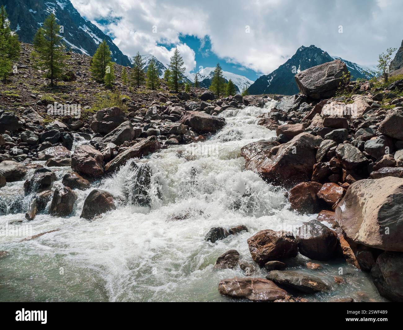 Stormy mountain river with rapids. Beautiful alpine landscape with ...