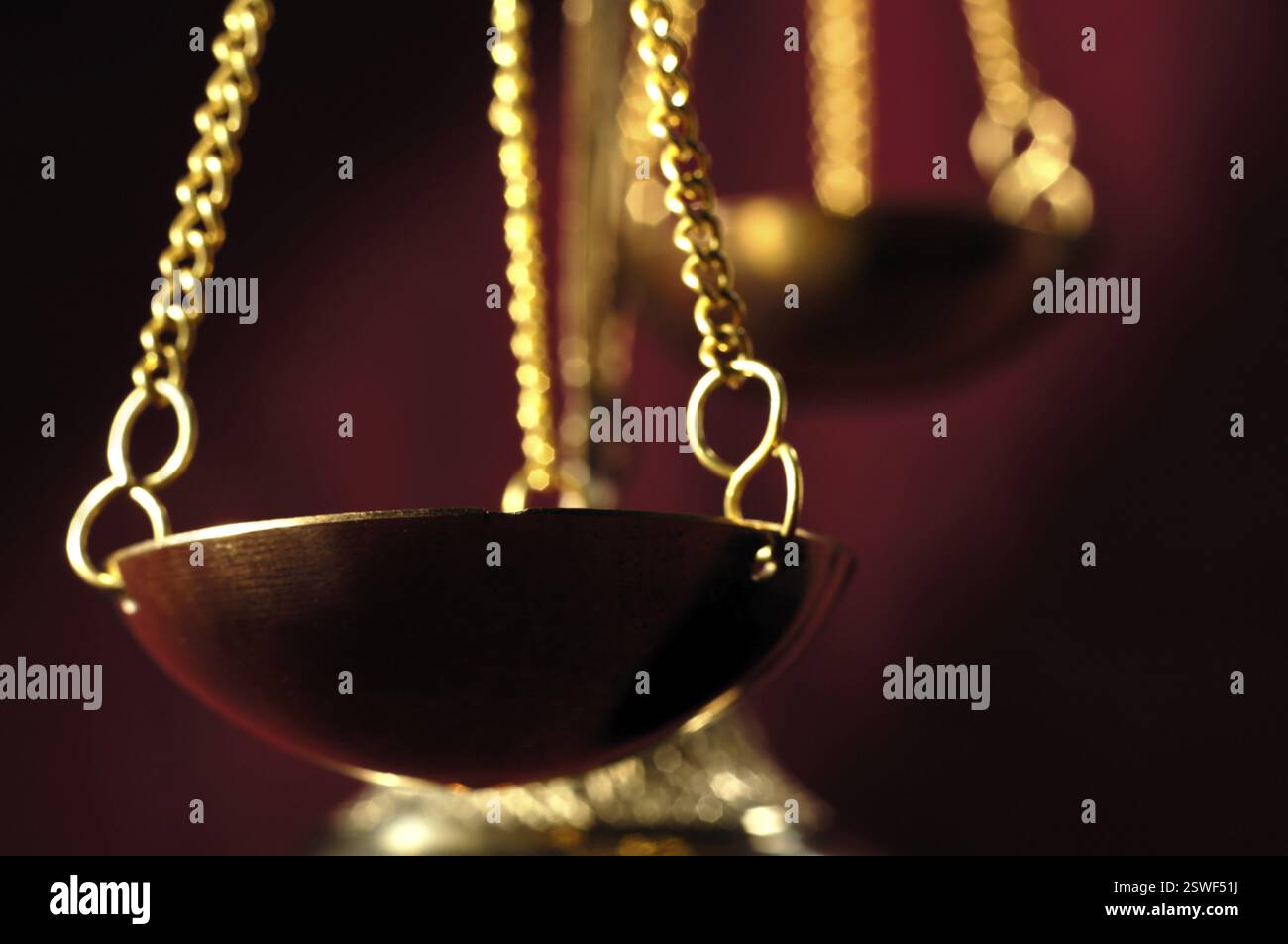 Stock photo of Shiny golden empty unbalanced vintage justice scales ...