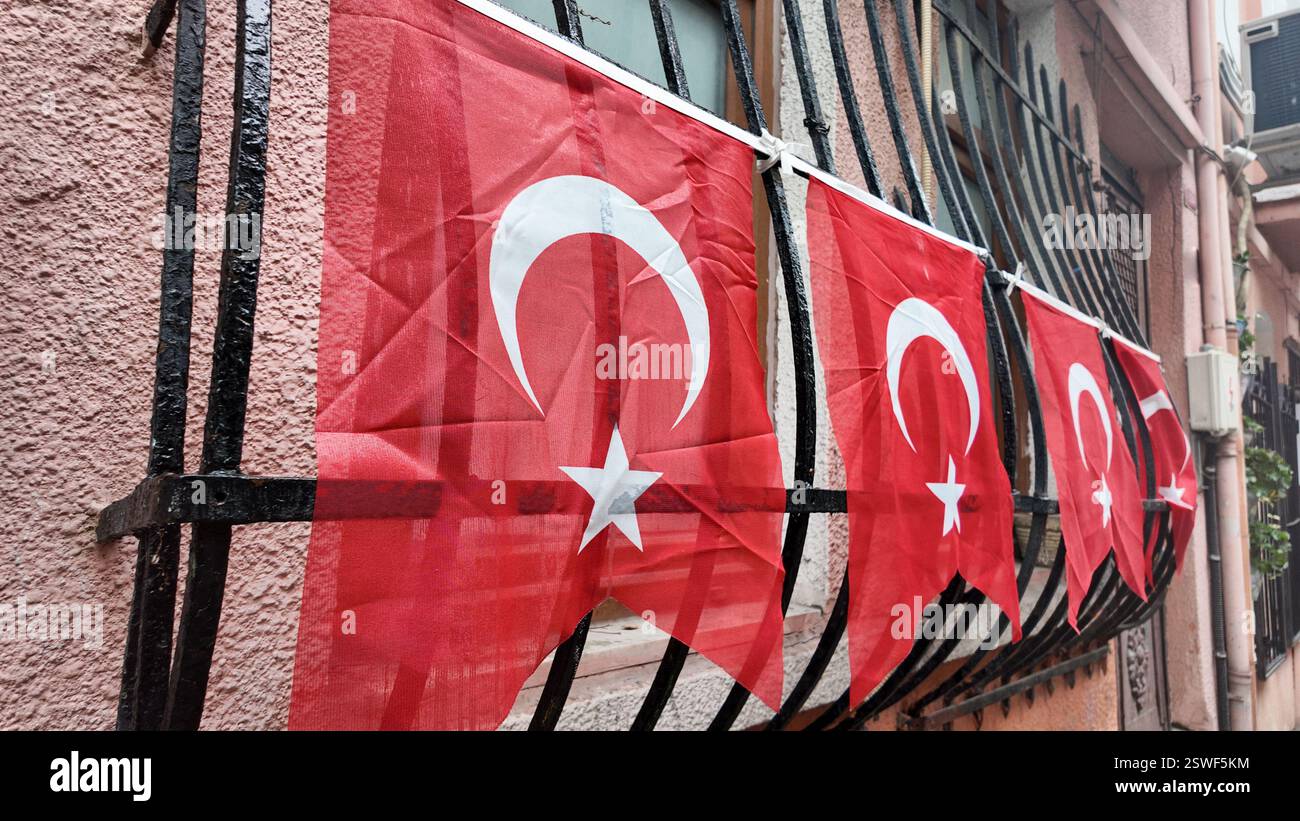Turkish flags hang from balcony in urban neighborhood Stock Photo - Alamy