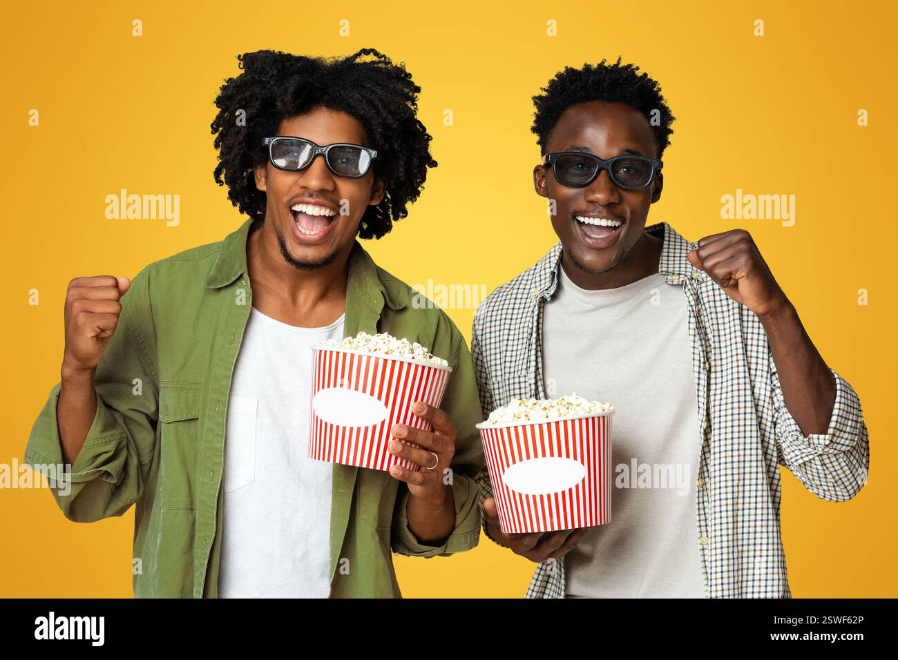 Cinema Fun. Two Cheerful Black Guys In 3d Glasses Holding Popcorn Buckets Stock Photo - Alamy