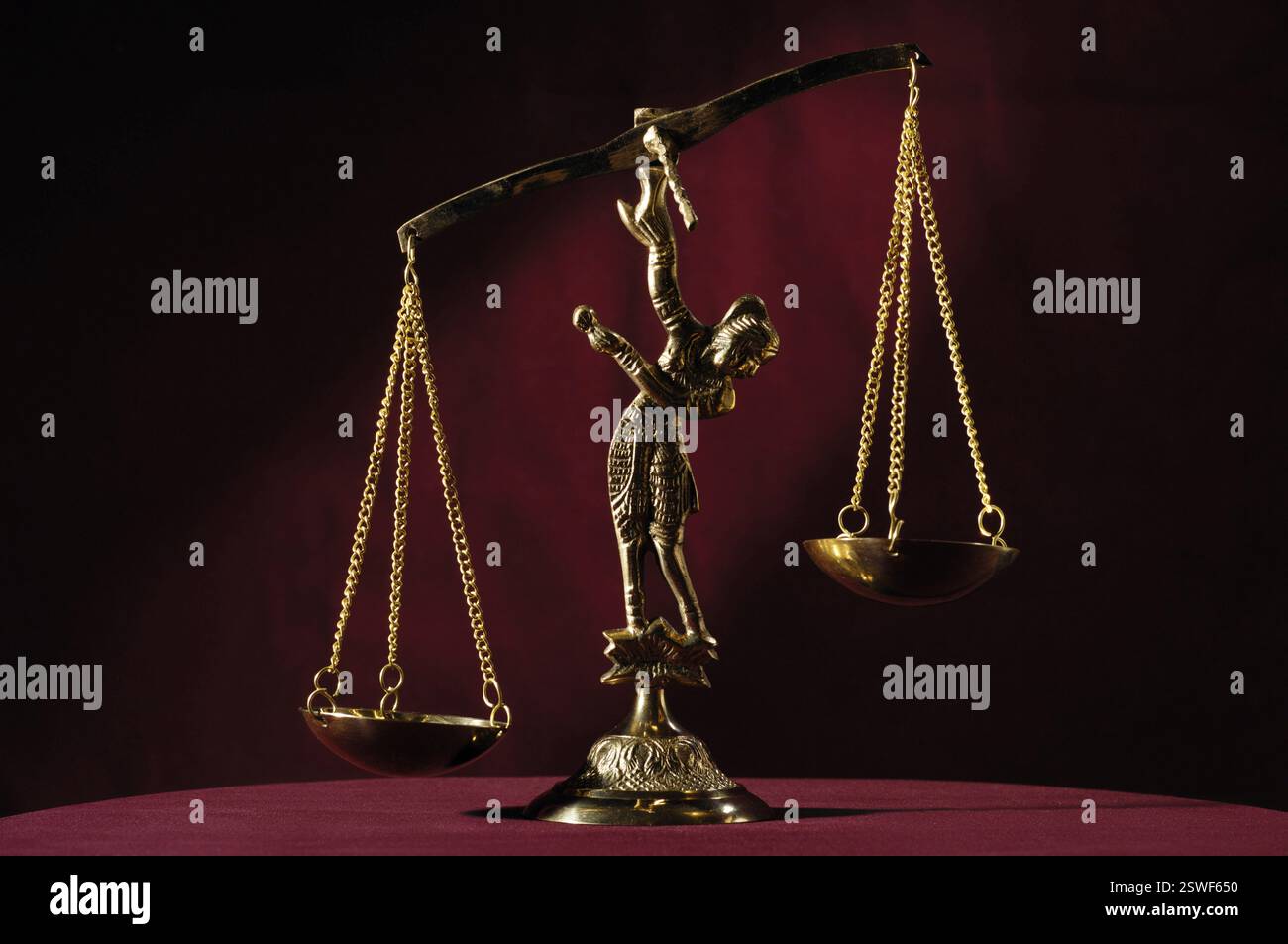 Stock photo of Shiny golden empty unbalanced vintage justice scales ...