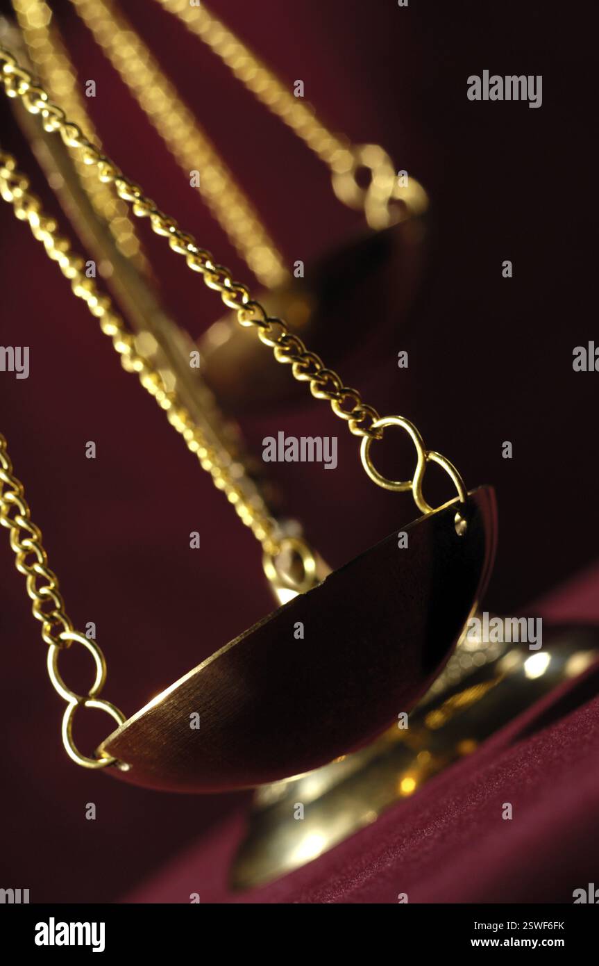 Stock photo of Shiny golden empty unbalanced vintage justice scales ...