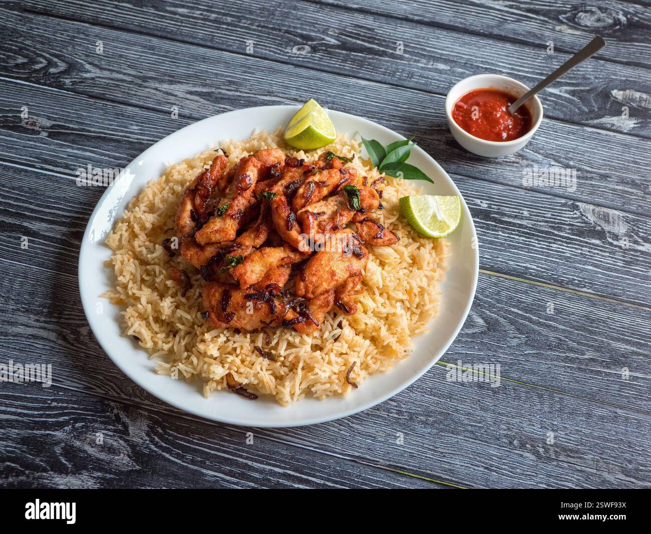Spicy Chicken fry with basmati rice. South India dish Stock Photo - Alamy