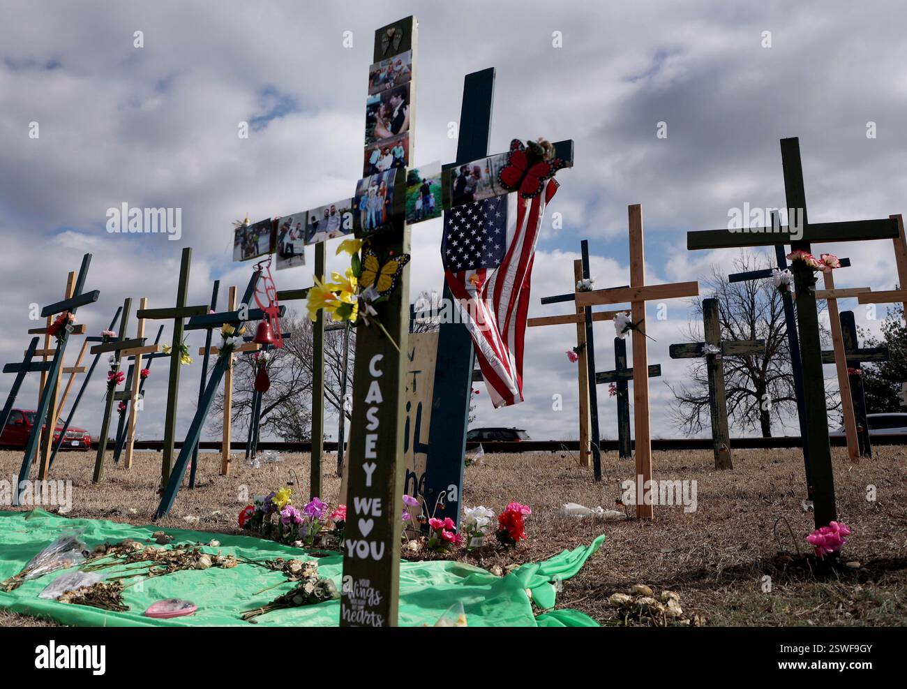 Washington Dc, Virginia, USA. 20th Feb, 2025. A cross with the pictures ...