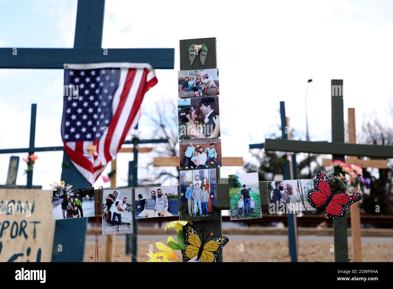 Washington Dc, Virginia, USA. 20th Feb, 2025. A cross with the pictures ...