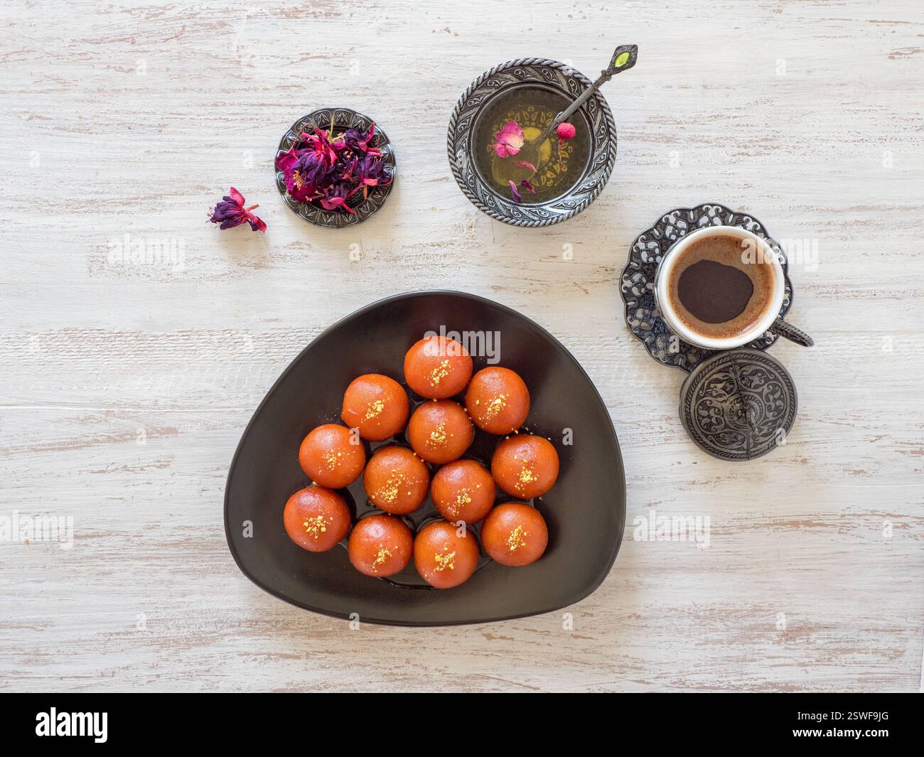 Gulab Jamun - Traditional Indian sweets on a white wooden table. Top ...