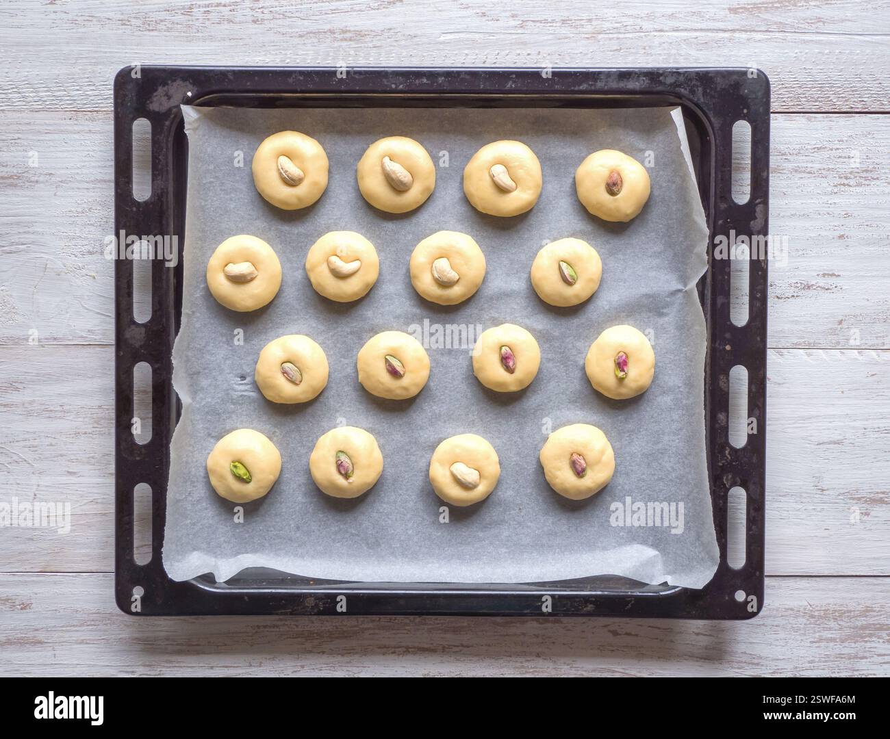 Peda (Indian sweet) cookies on a baking sheet. Eid and Ramadan Dates ...