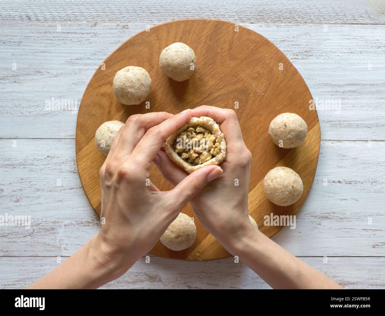 Cooking of Arabic meat appetizer Kibbeh. Traditional Arabic kibbeh with ...