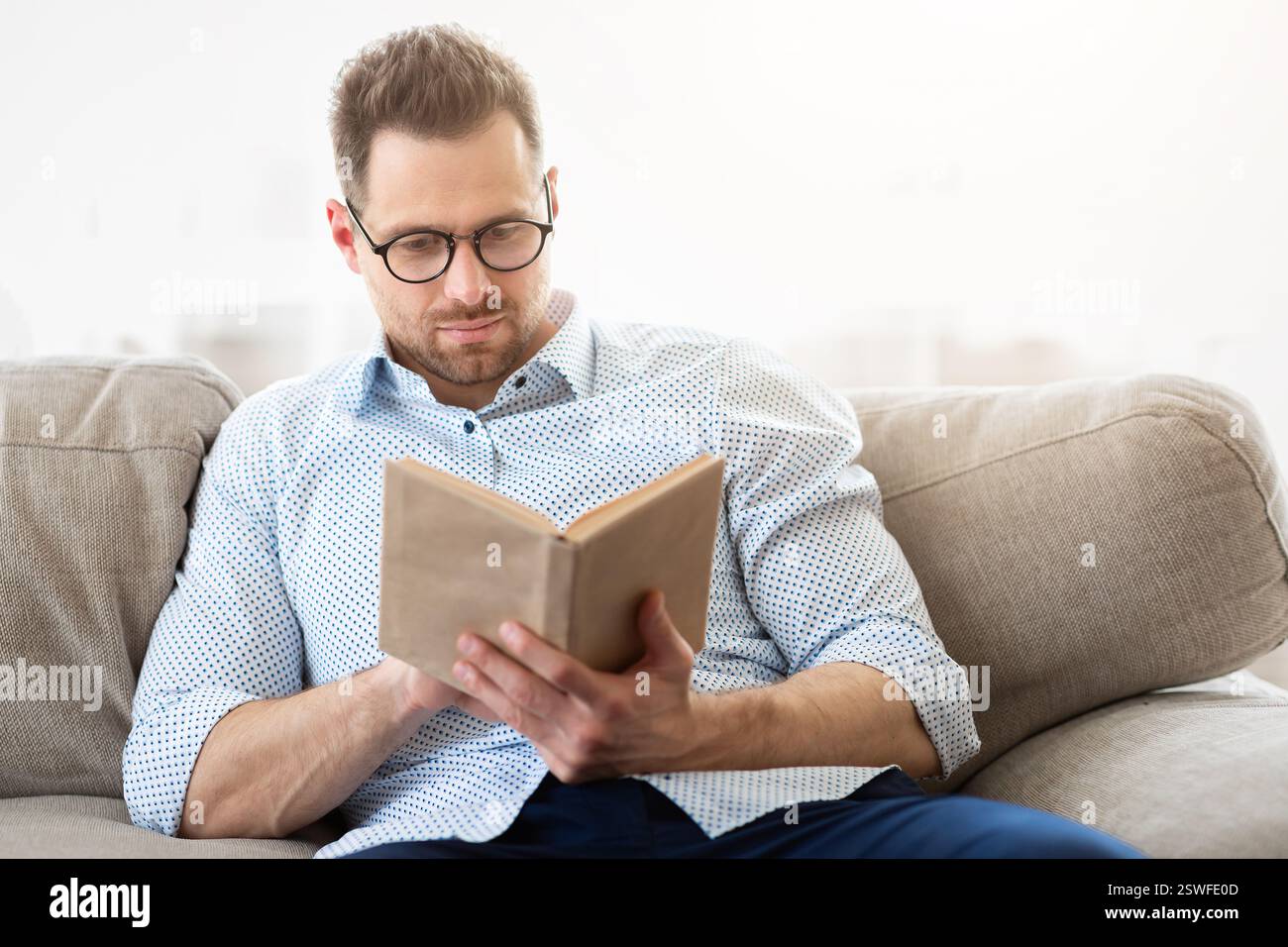 Handsome intelligent man holding hi-res stock photography and images ...