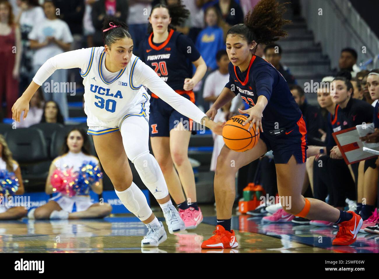 UCLA forward Timea Gardiner (30) and Illinois forward Brynn Shoup-Hill ...