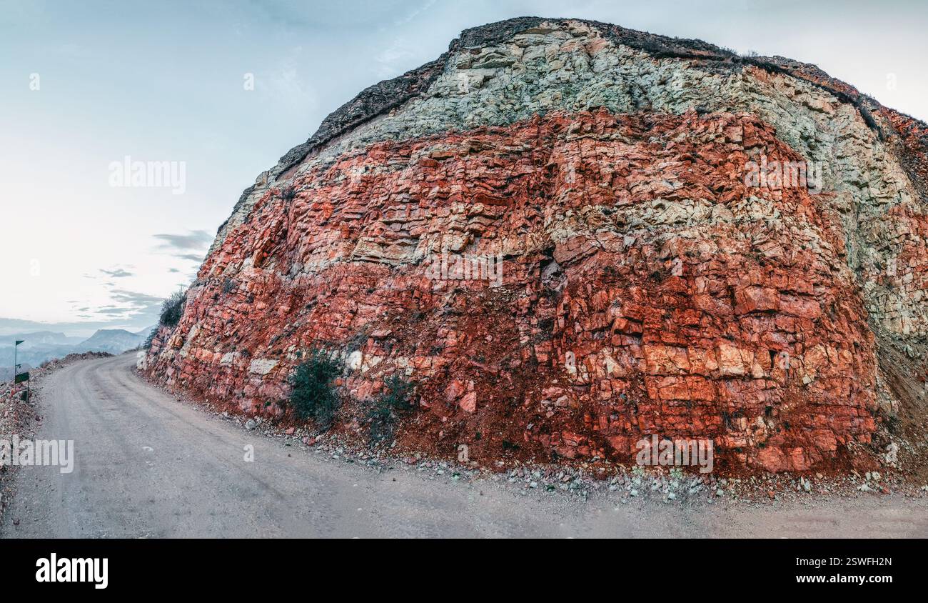 Colored layers of stones in section of the mount, different rock ...