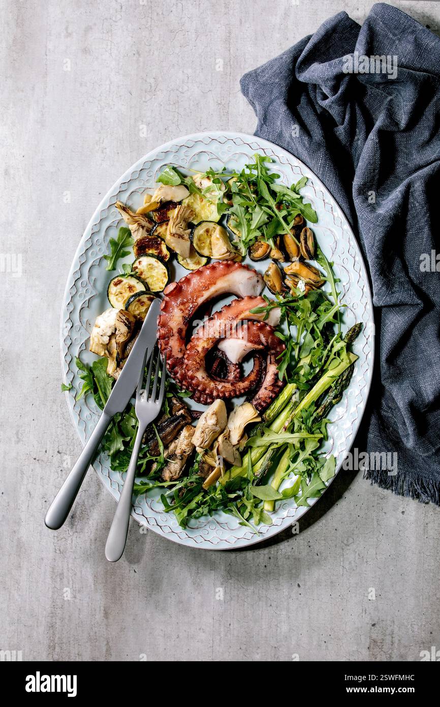 Seafood salad. Coocked grilled tentacles of octopus, sardines and ...