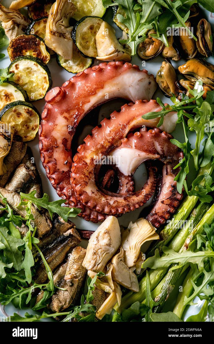 Coocked grilled tentacles of octopus, sardines and mussels Stock Photo ...